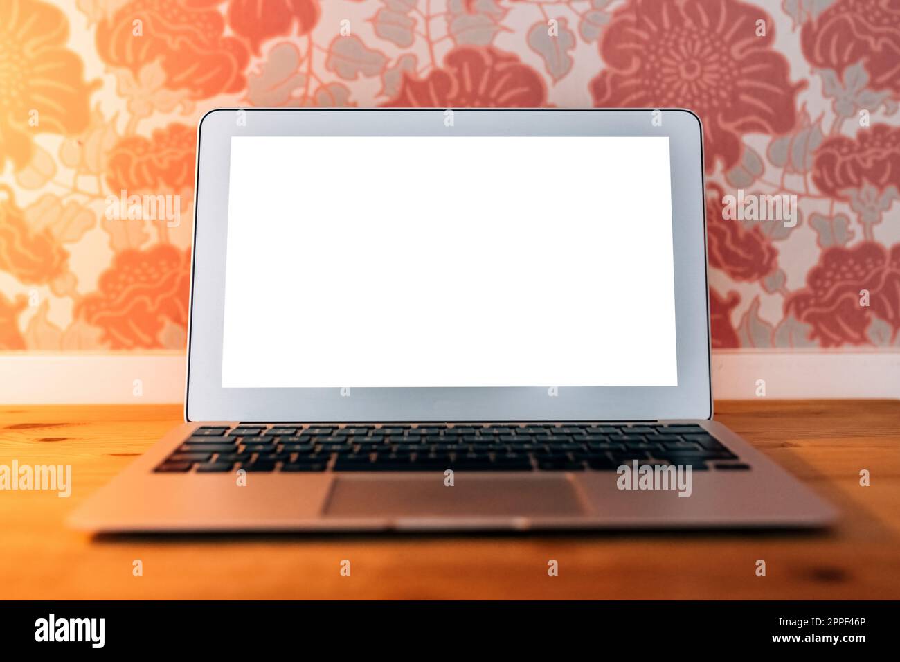 Laptop computer with blank white mockup screen on living room desk, selective focus Stock Photo ...