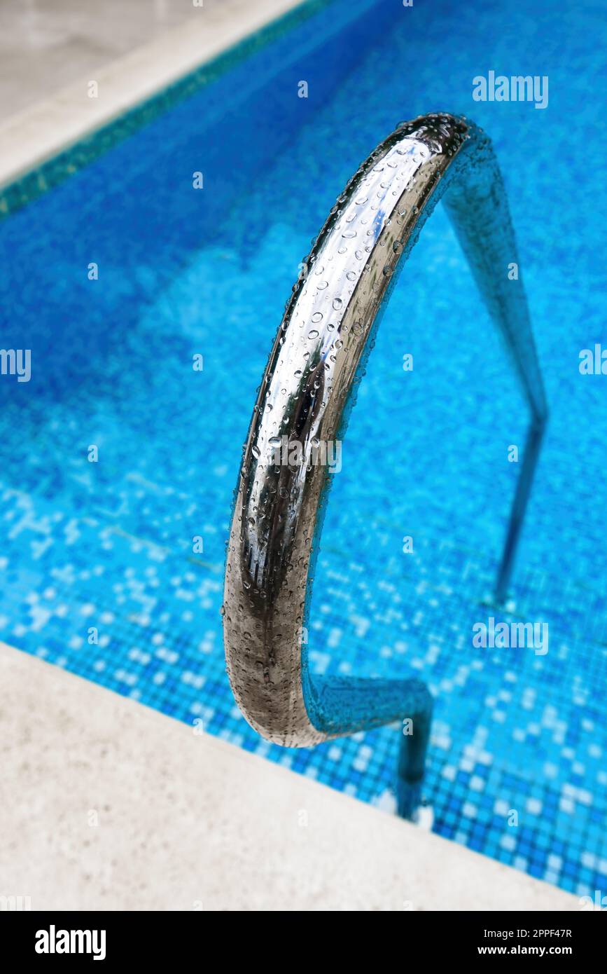 Outdoor swimming pool railing with water drops, selective focus Stock ...