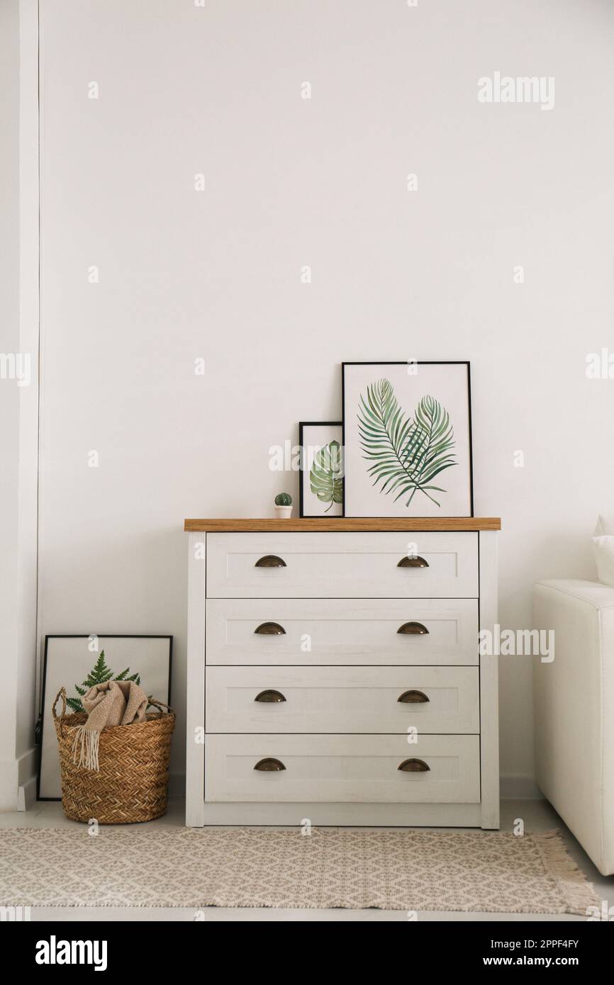 Modern chest of drawers in living room. Interior design Stock Photo - Alamy