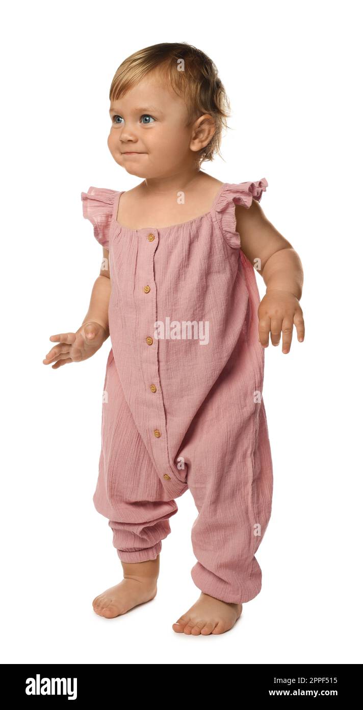 Cute baby girl learning to walk on white background Stock Photo - Alamy