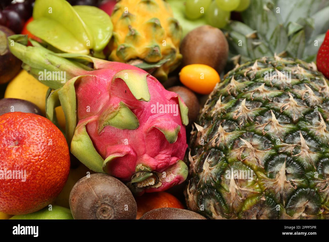 Assortment of fresh exotic fruits as background, closeup Stock Photo ...