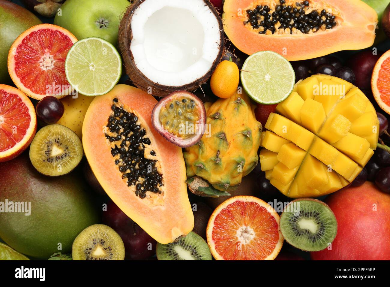 Many different delicious exotic fruits as background, top view Stock ...