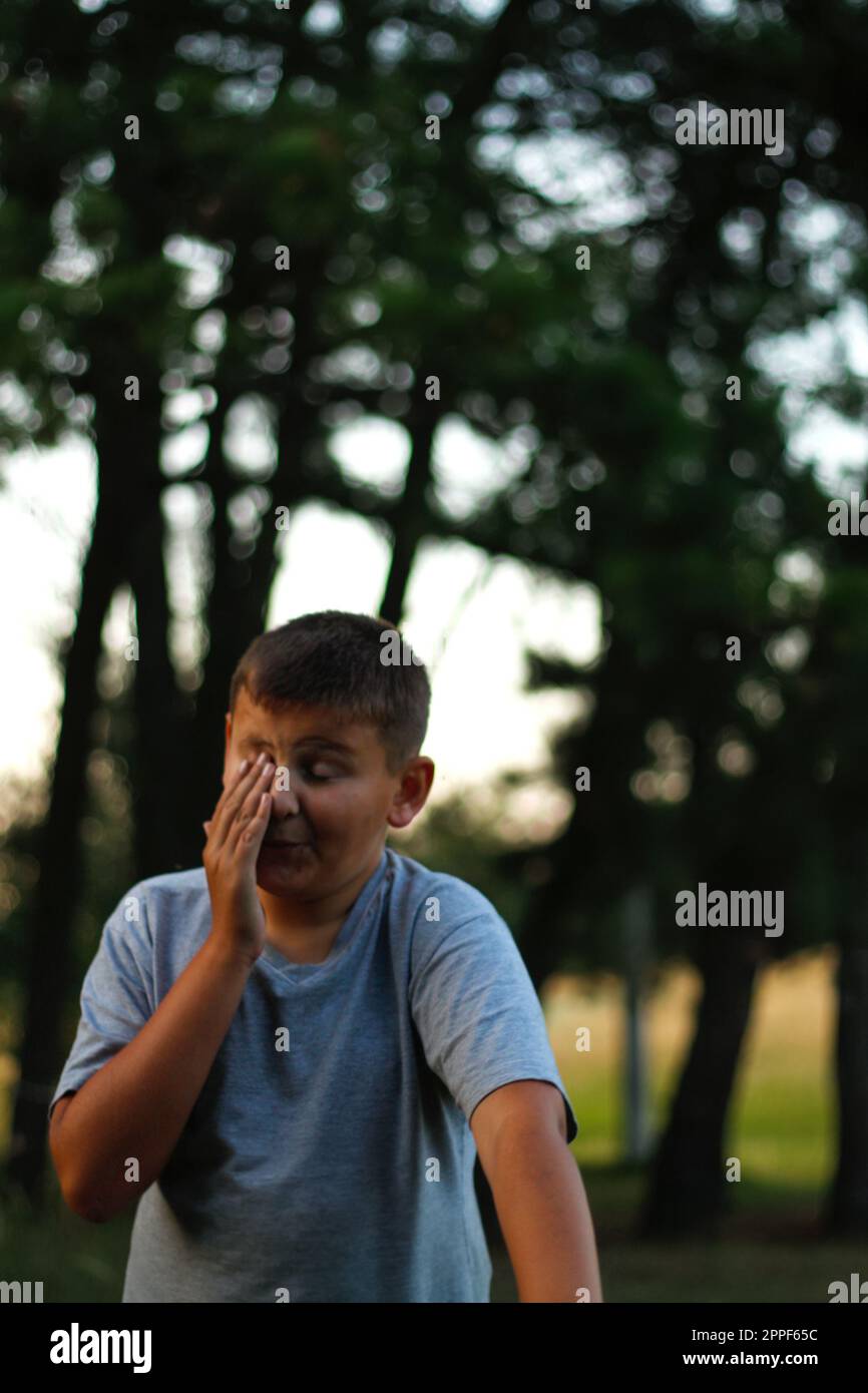 Portrait of preteen surprised happy boy close-up. Hand on face, Funny ...