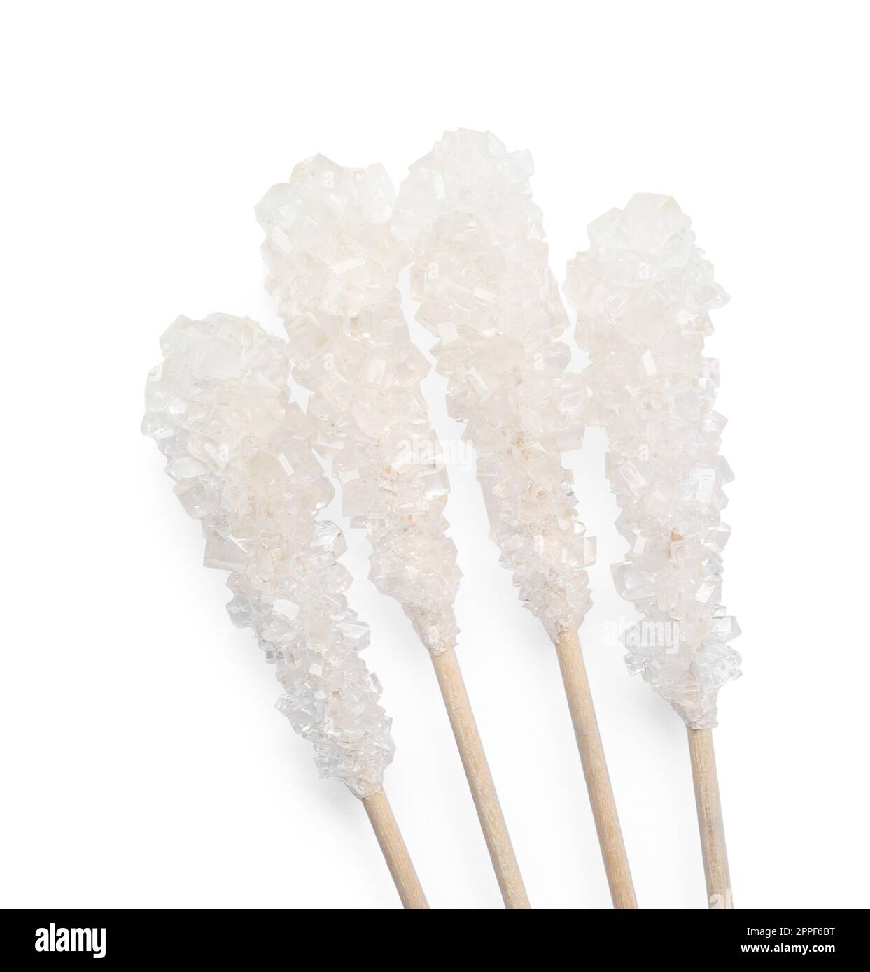 Wooden sticks with sugar crystals isolated on white, top view. Tasty ...