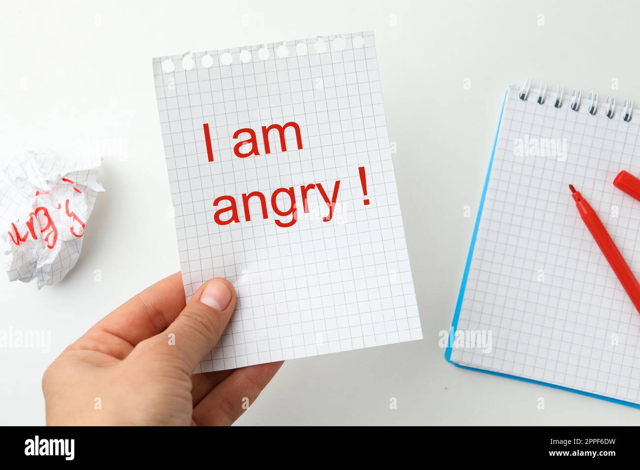 Woman holding crumpled paper and pen hi-res stock photography and ...