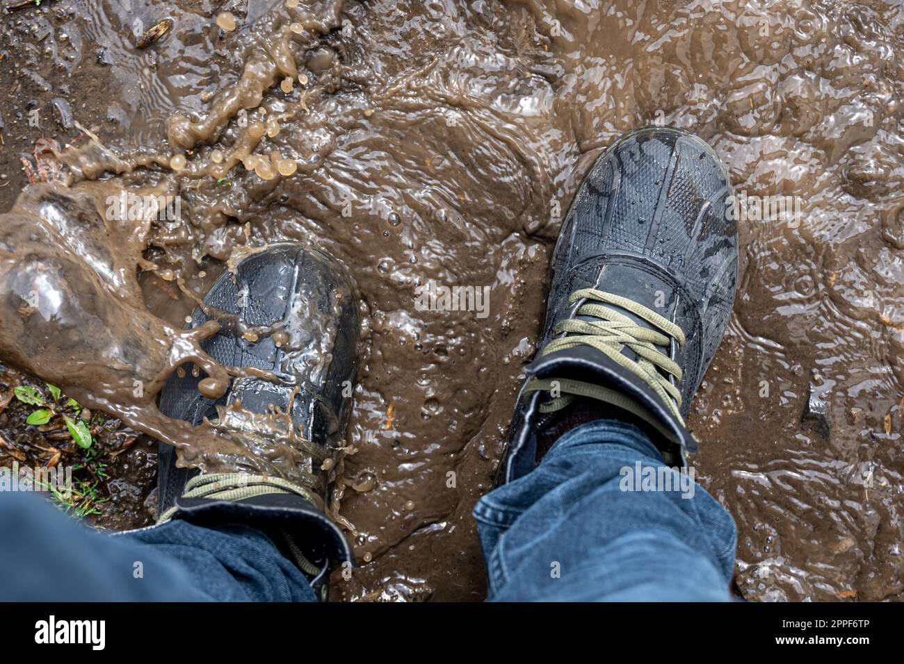 Pair of sneakers in mud hi-res stock photography and images - Alamy