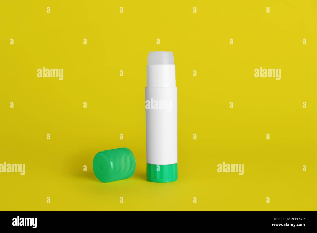 Blank glue stick and cap on yellow background Stock Photo - Alamy