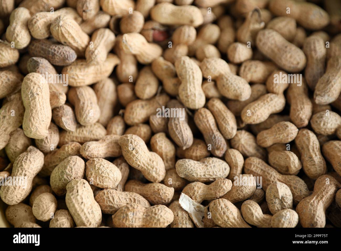 Heap of delicious peanuts as background, closeup view Stock Photo - Alamy
