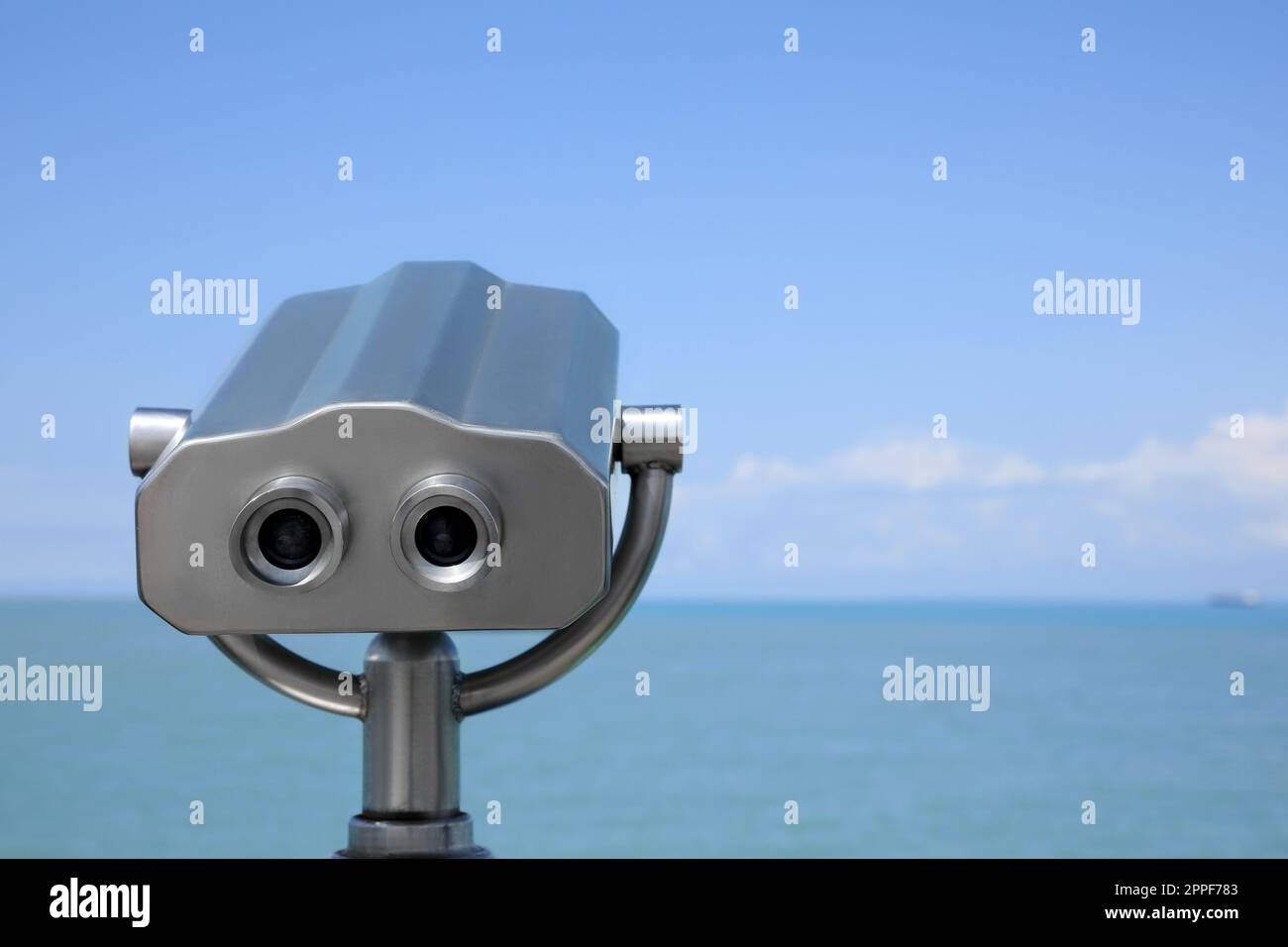Metal tower viewer installed near sea, space for text. Mounted ...