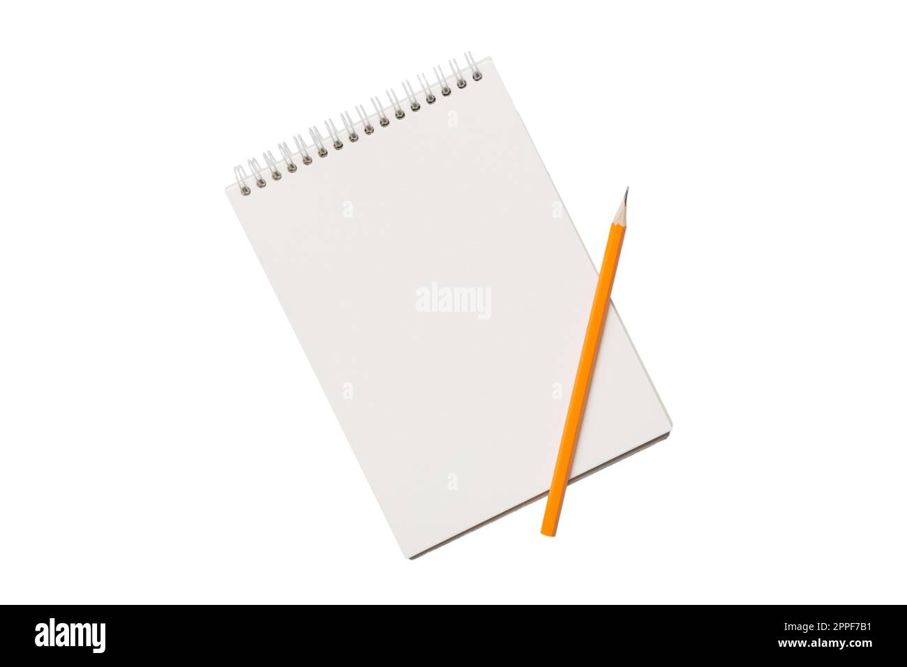 Top view of closed spiral blank white paper cover notebook with pencil ...