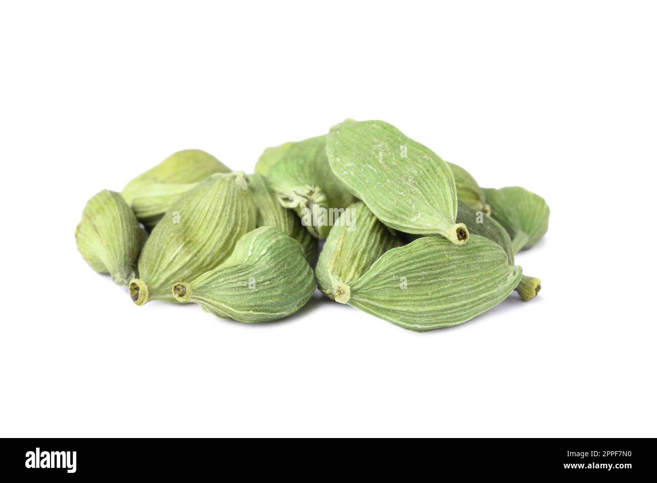 Pile of dry green cardamom on white background Stock Photo - Alamy