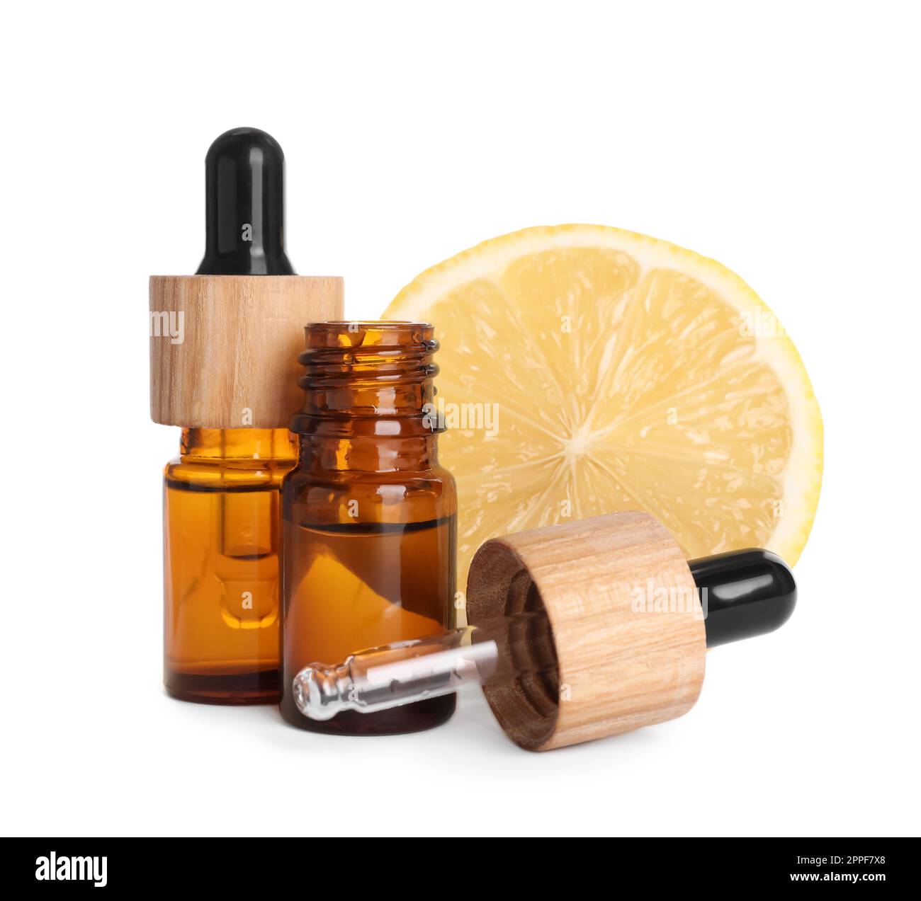 Bottles of citrus essential oil and fresh lemon isolated on white Stock ...