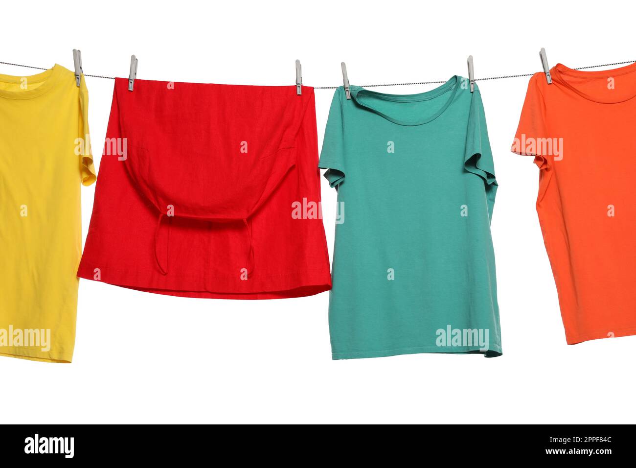 Different bright clothes drying on washing line against white ...