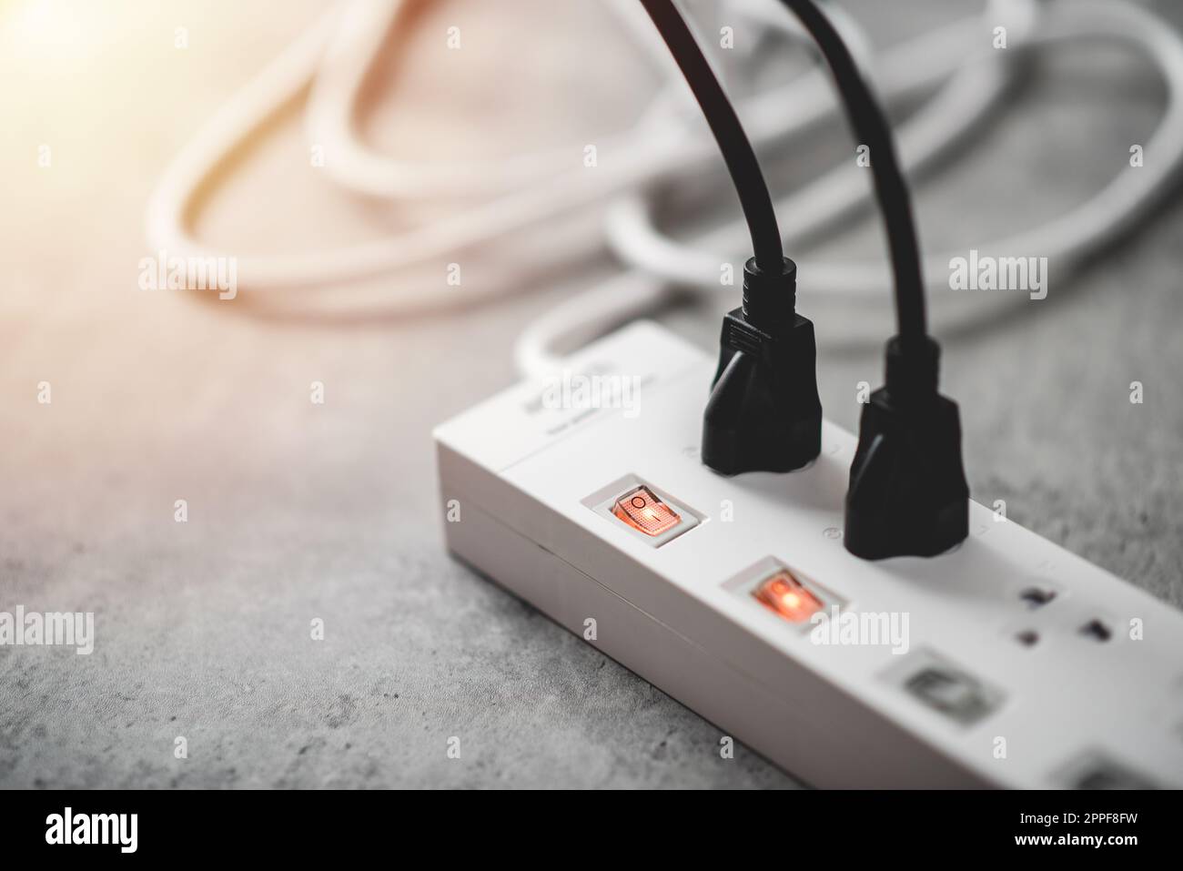 Many plugs connected to the power strip with individual switches Stock ...