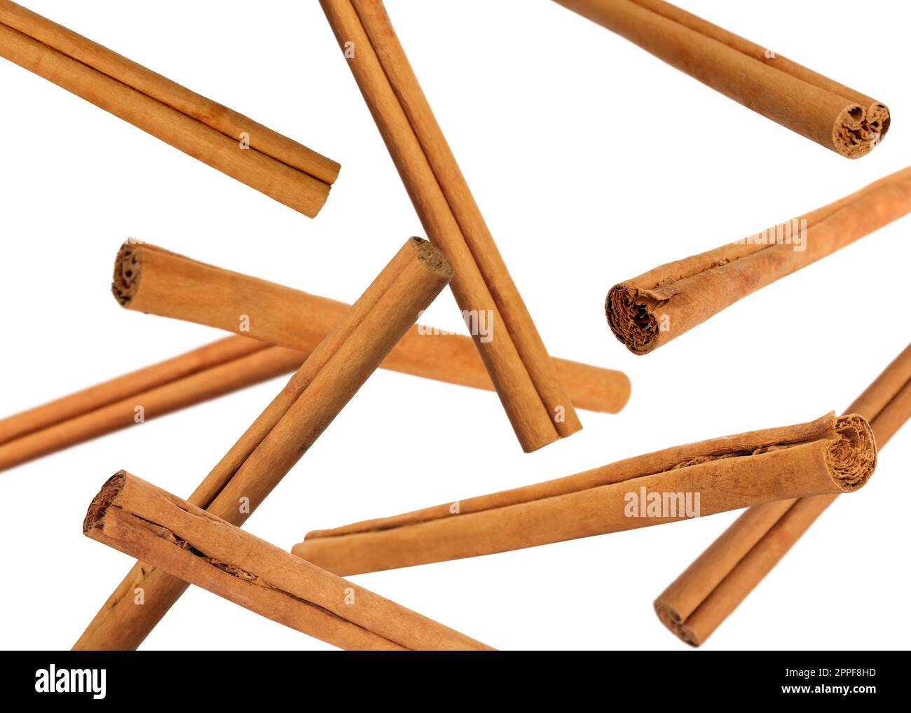 Aromatic dry cinnamon sticks falling on white background Stock Photo ...