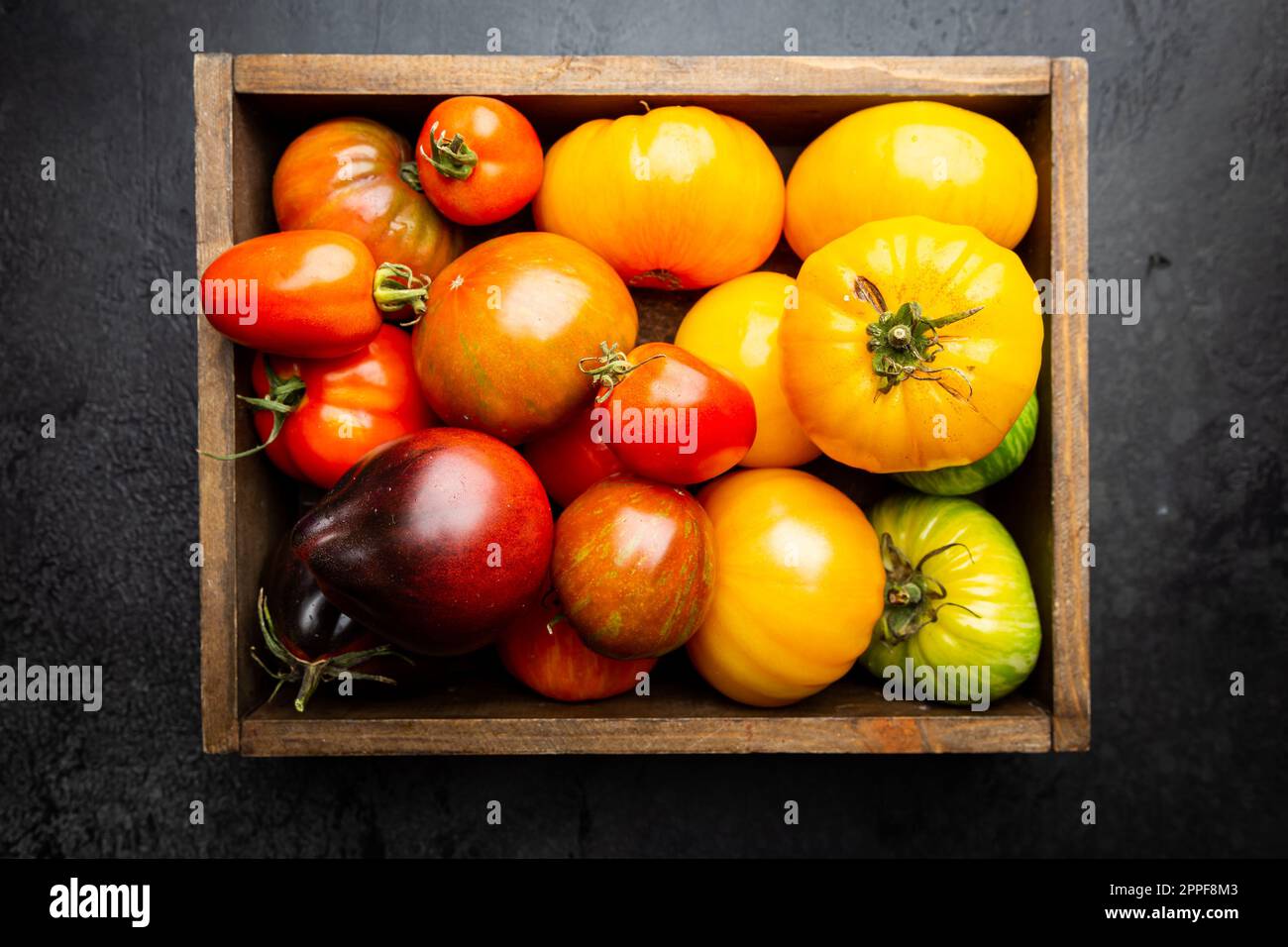 Mixed tomatoes top view Stock Photo - Alamy