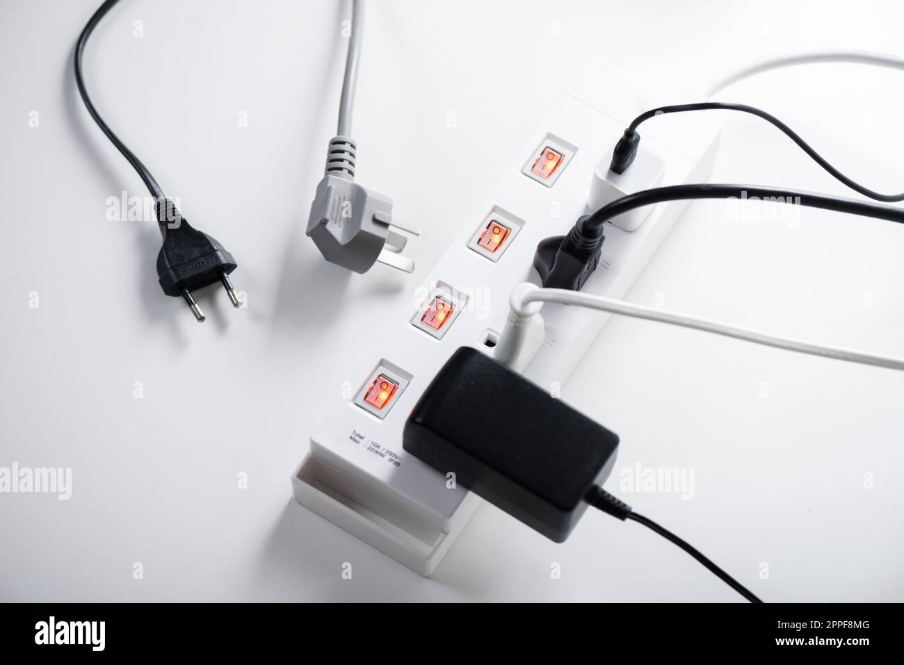 Many plugs connected to the power strip with individual switches Stock ...