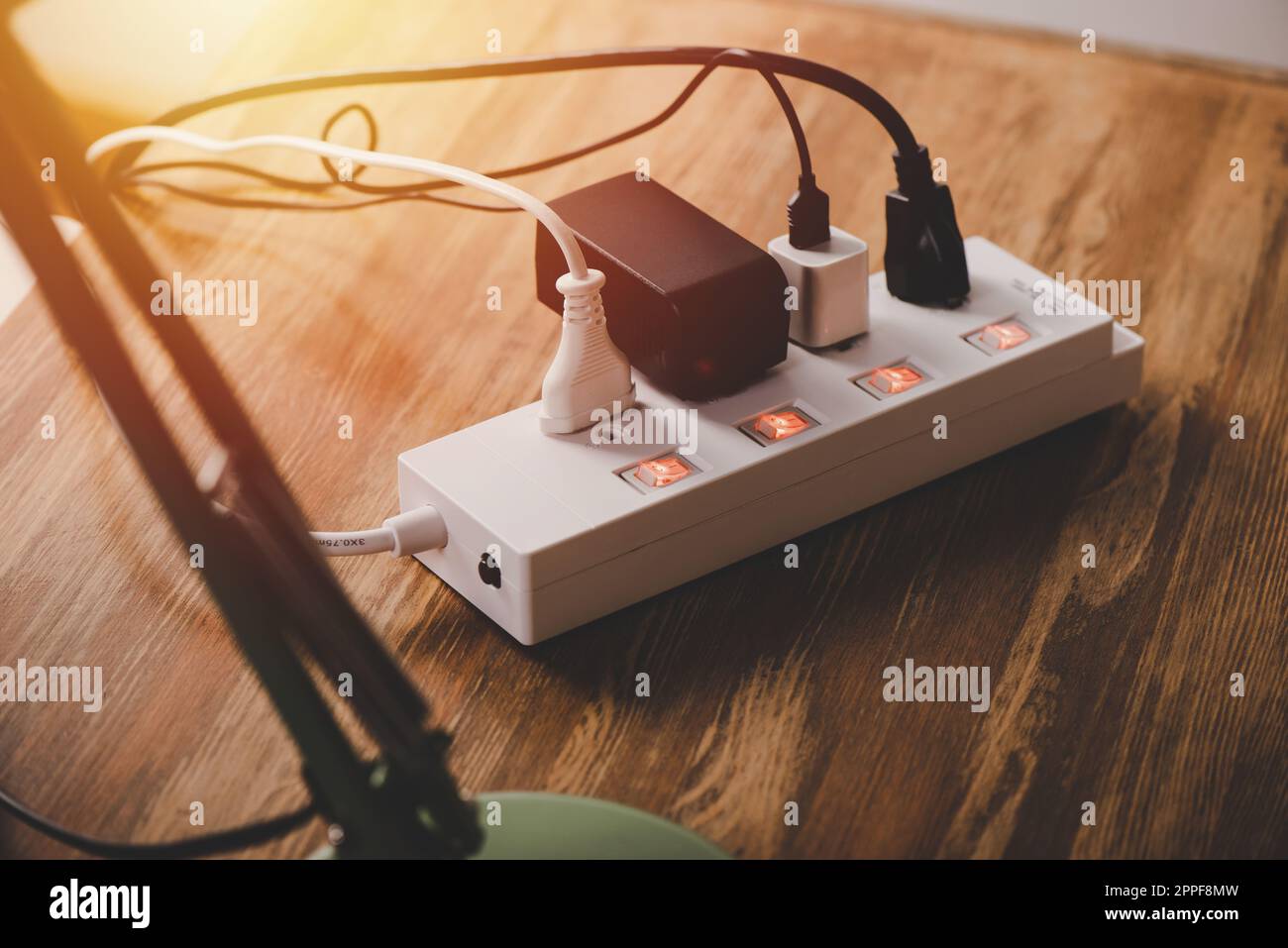 Many plugs connected to the power strip with individual switches Stock ...