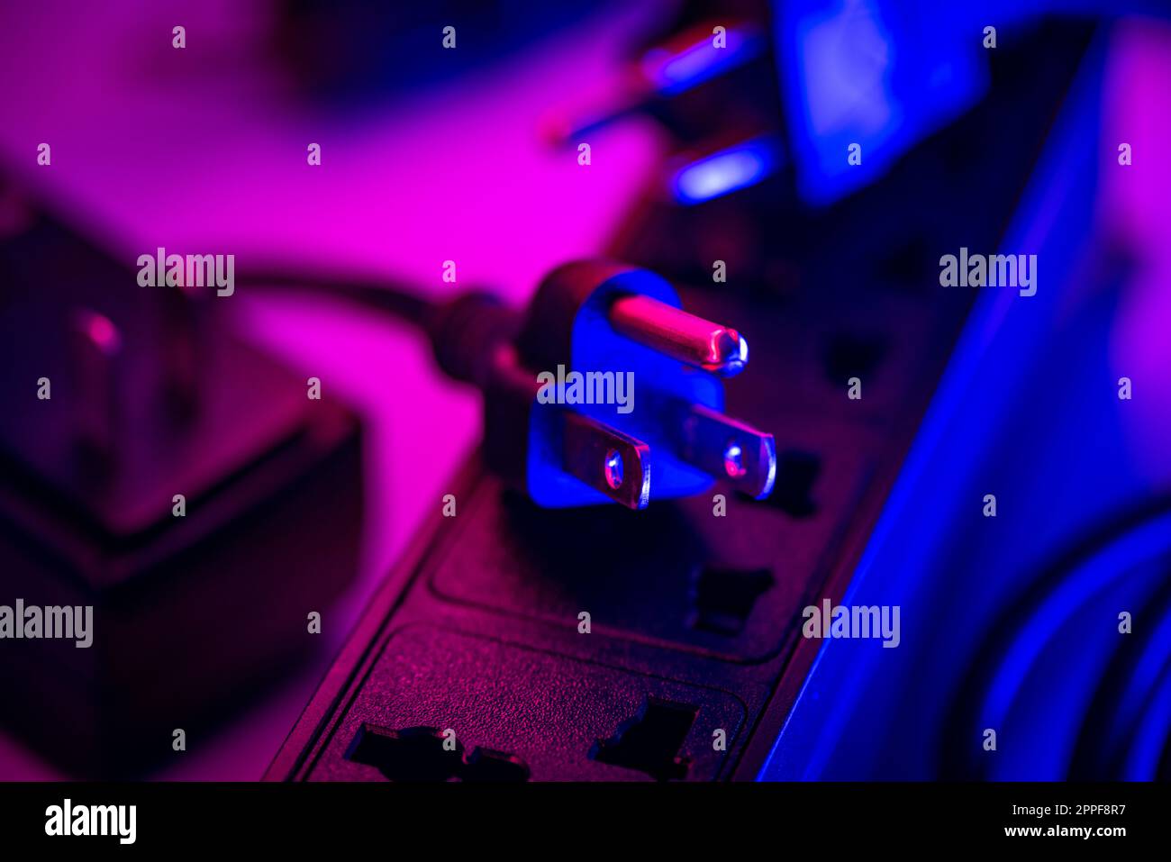 Close up 3-leg plug on electrical power strip Stock Photo - Alamy