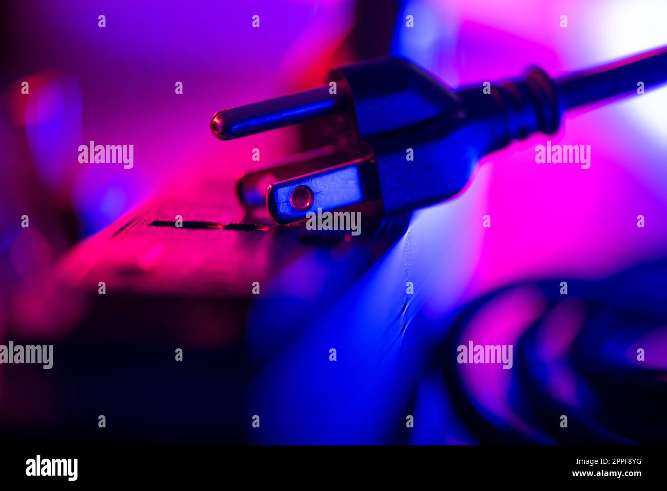 Close up 3-leg plug on electrical power strip Stock Photo - Alamy