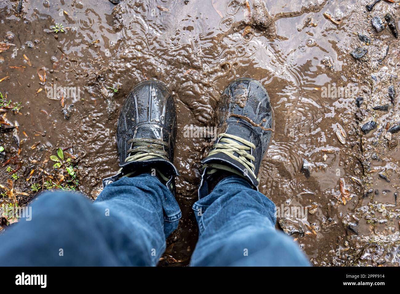 Pair of sneakers in mud hi-res stock photography and images - Alamy