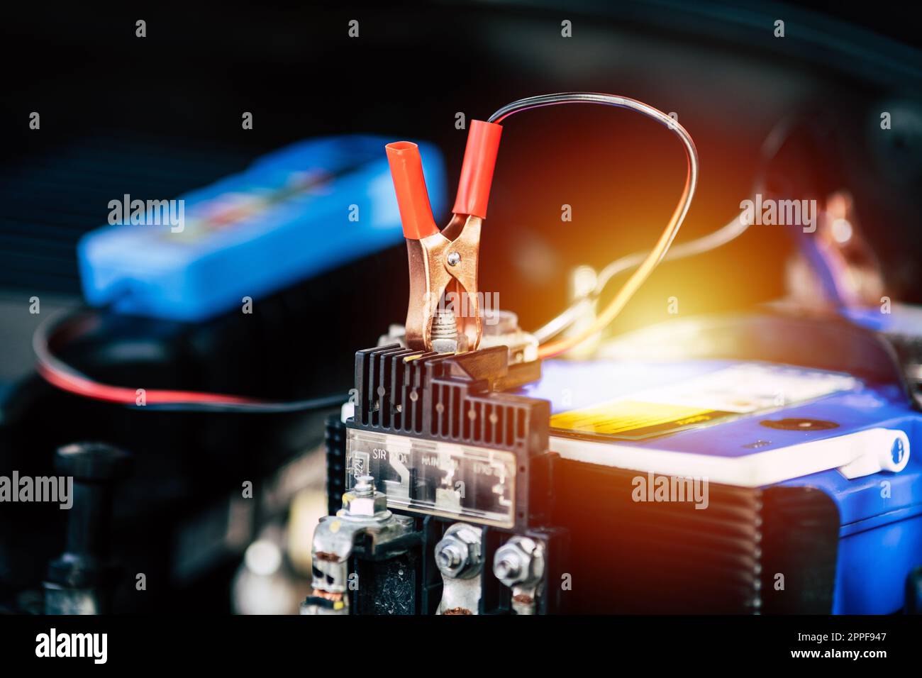 Checking a car battery level with car battery checker, car repairing ...