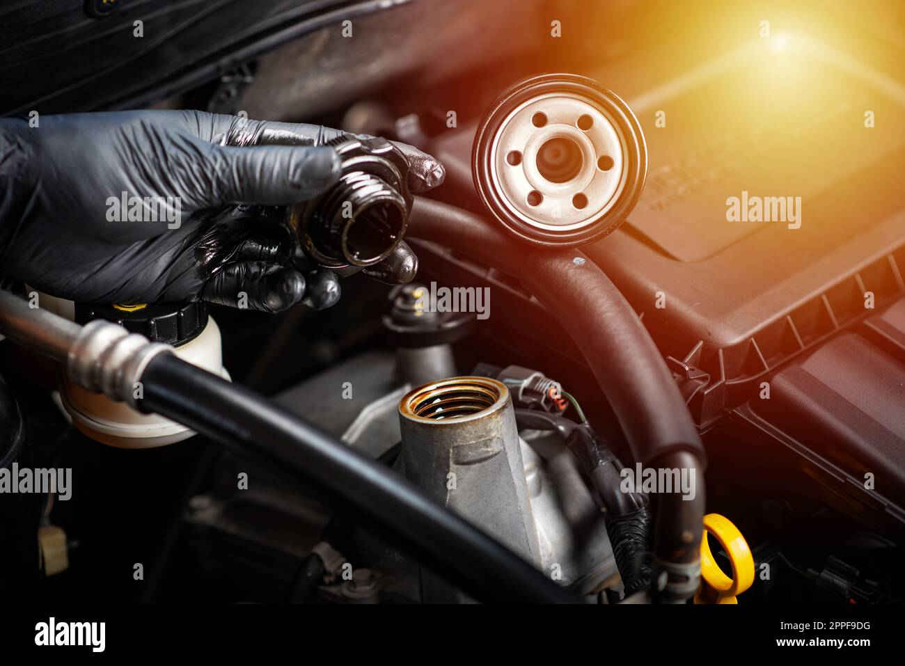 Technician opening the motor oil cap. Car maintenance concept Stock ...