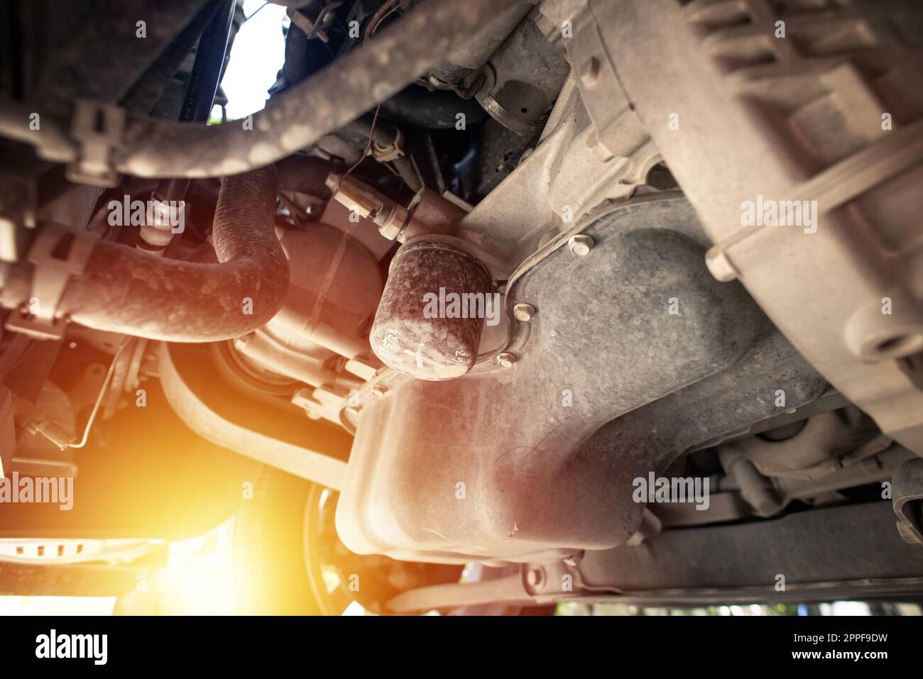 The oil filter installed on the motor, close up at an old oil filter ...