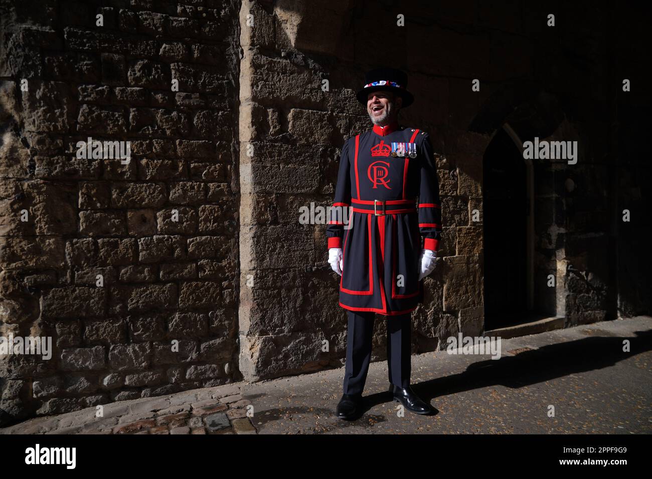 A Yeoman Warder, also known as a Beefeater, in their new uniform for King Charles III's ...