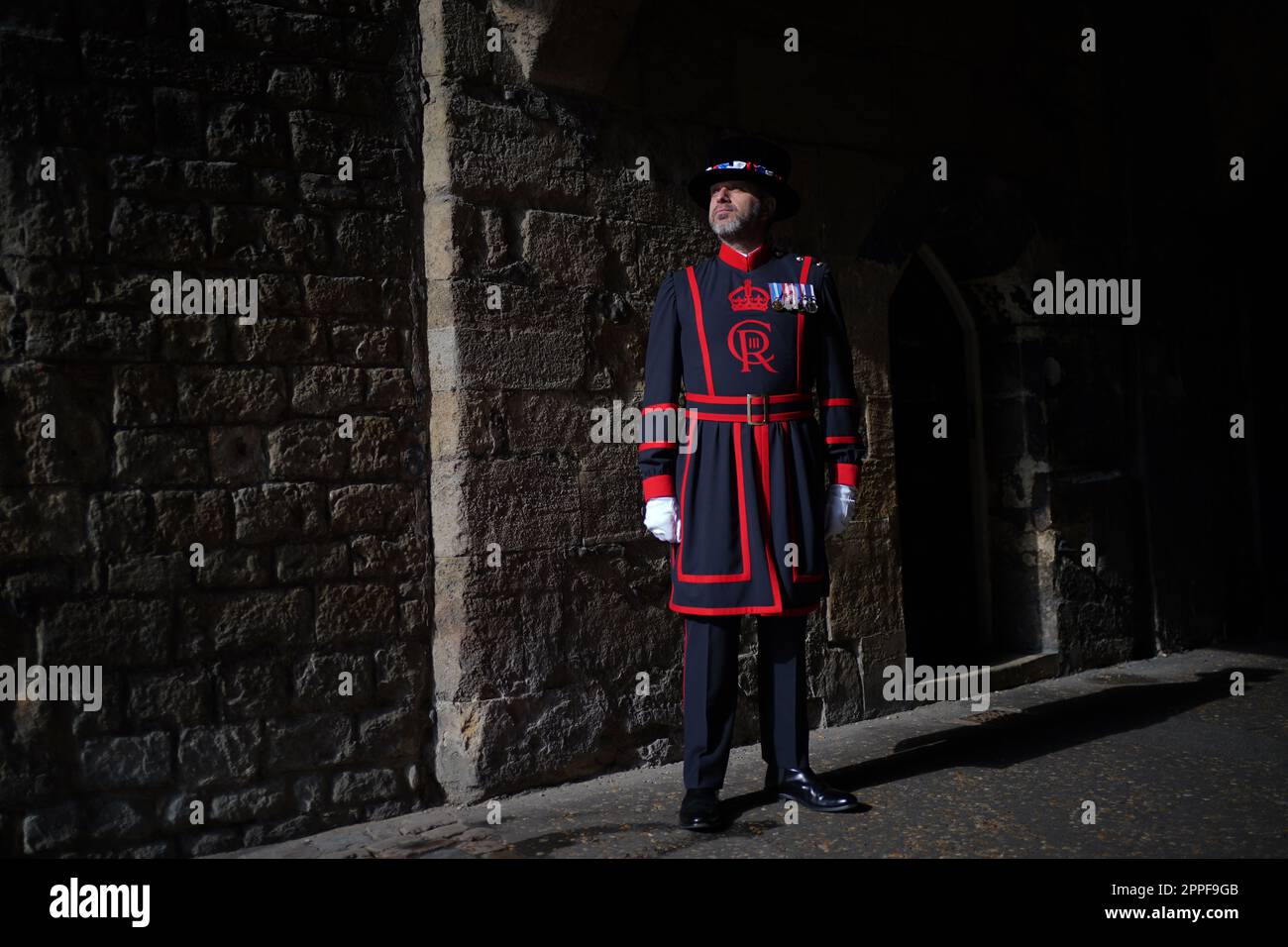 A Yeoman Warder, also known as a Beefeater, in their new uniform for ...