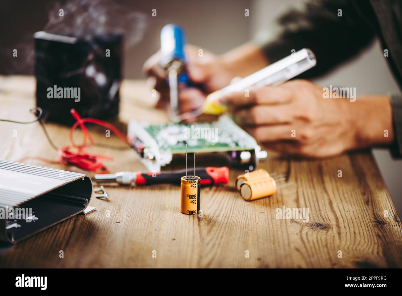 Technician repairing the electronic device. Reparing the audio ...