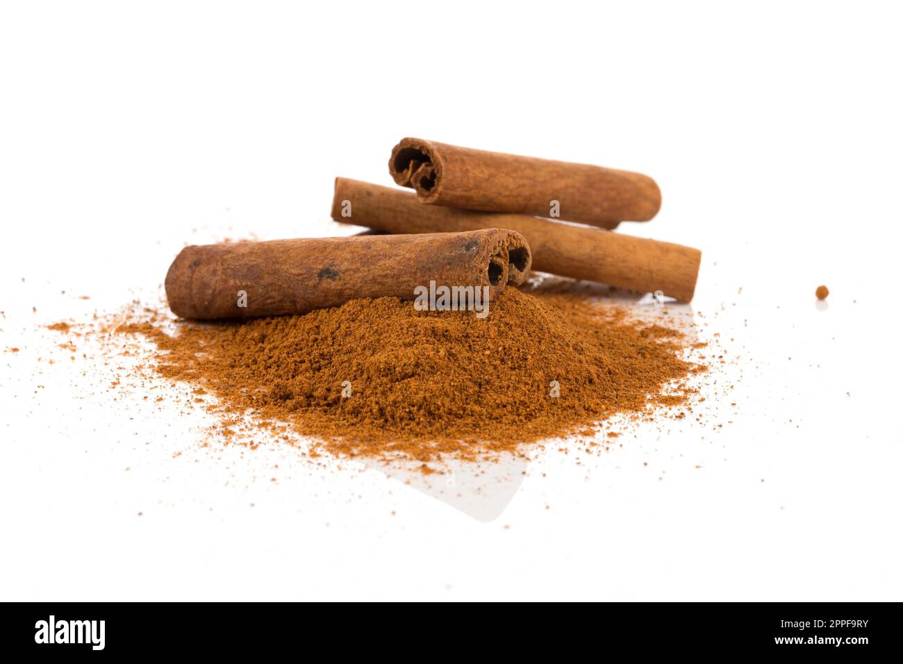 cinnamon powder isolated on a white background Stock Photo - Alamy