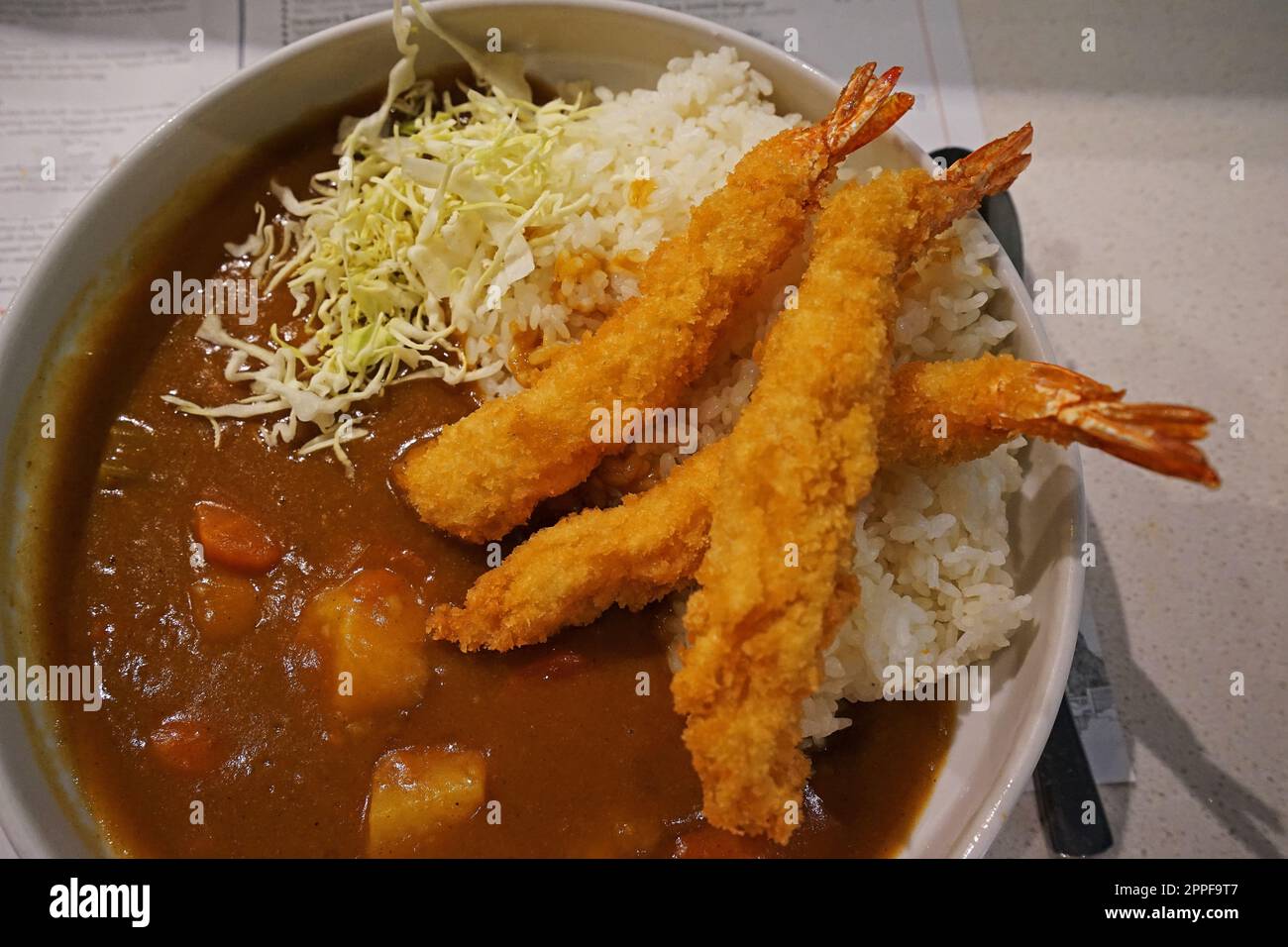 Close up Prawn Katsu curry, Battered and deep fried shrimp in a rich ...