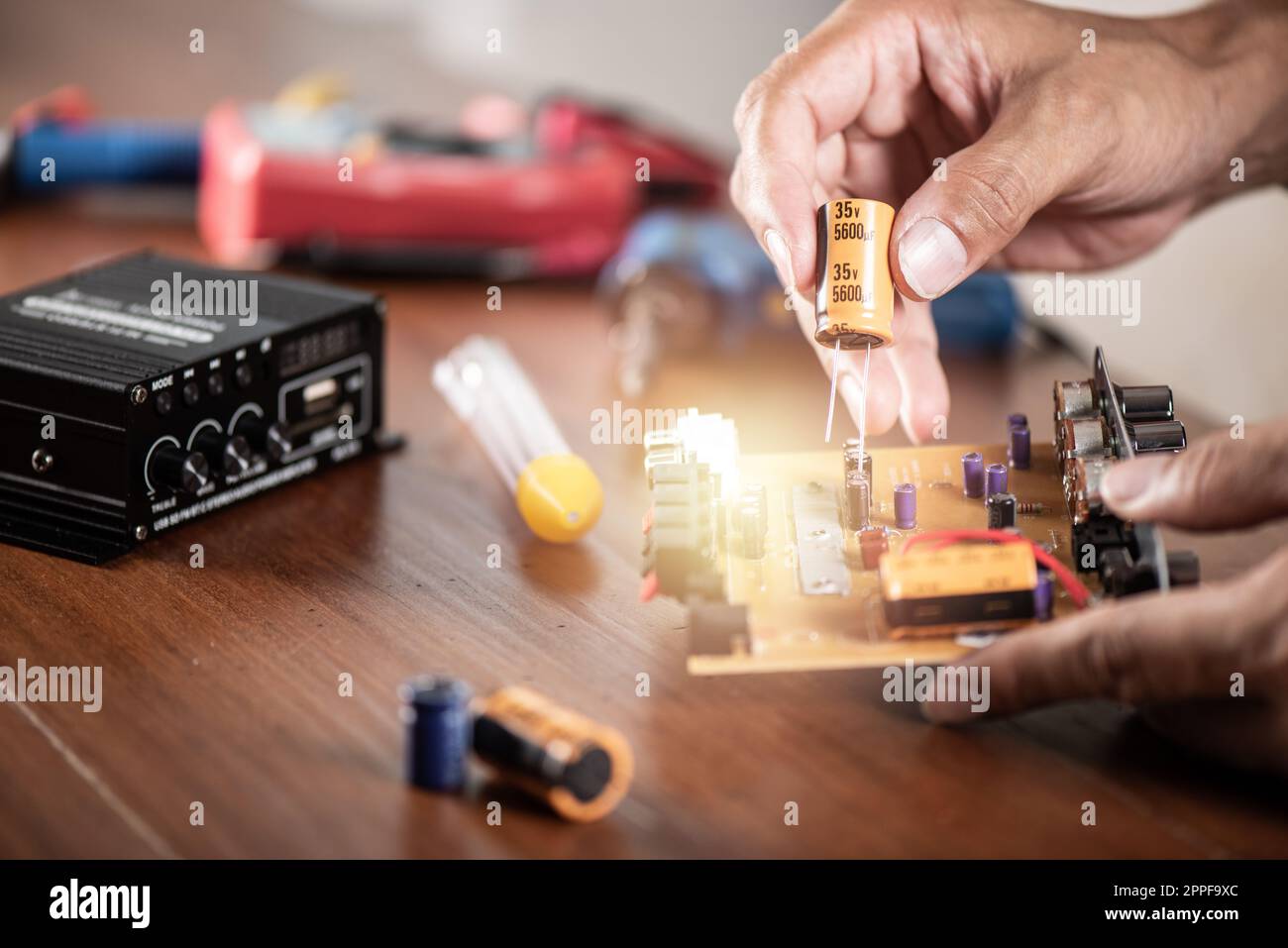Technician repairing the electronic device. Reparing the audio ...