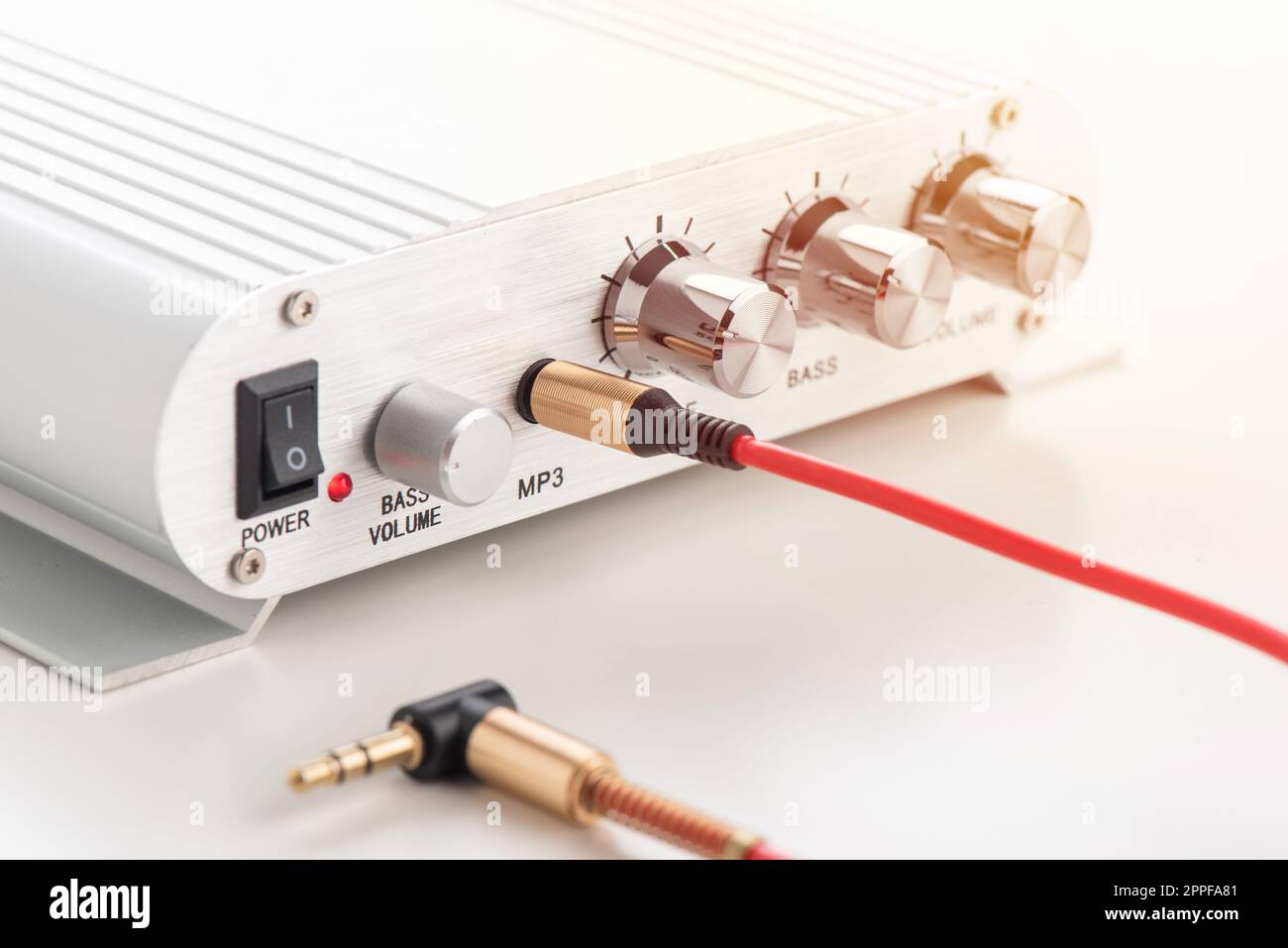 AUX cable connected to mini amplifier. Cable for stereo input and ...