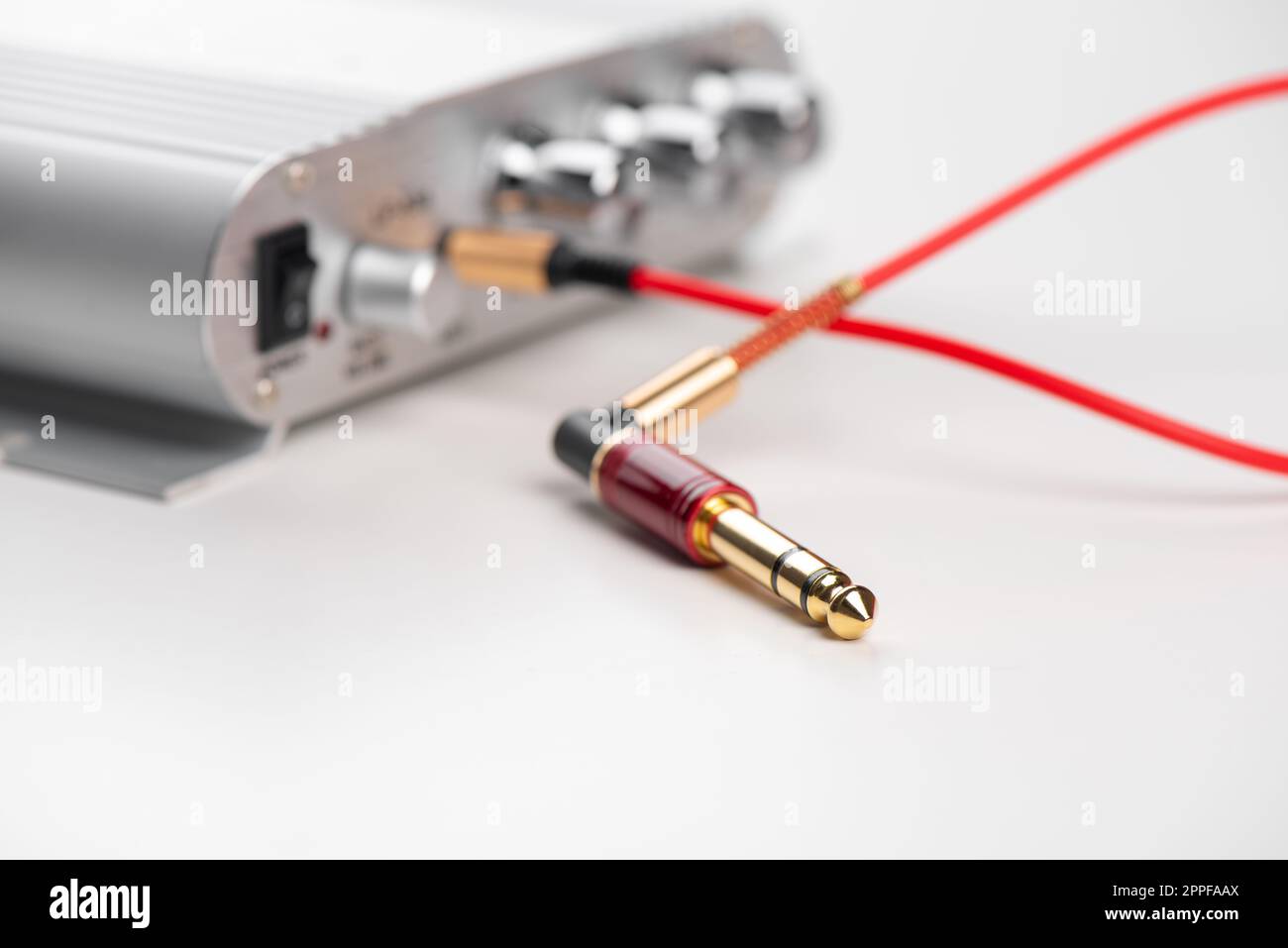 AUX cable connected to mini amplifier. Cable for stereo input and ...