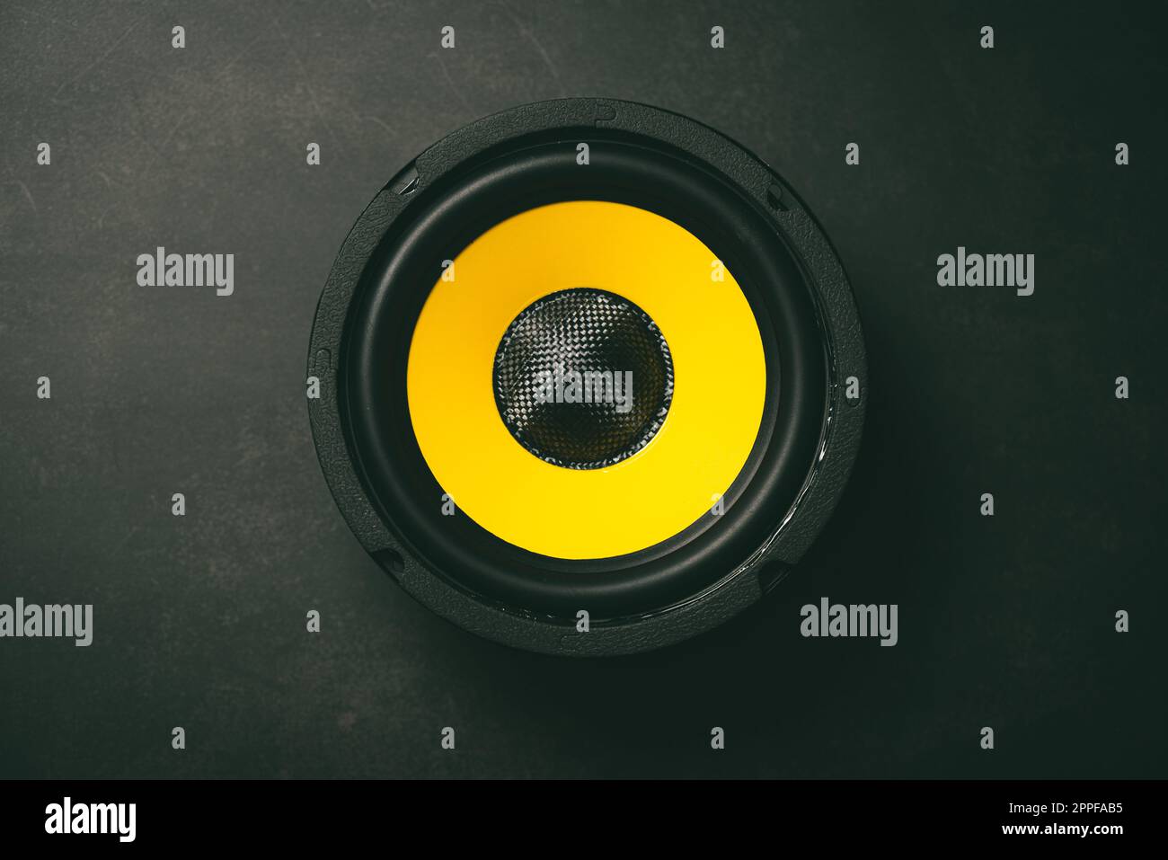 The black audio loudspeaker with yellow diaphragm. audio equipment ...