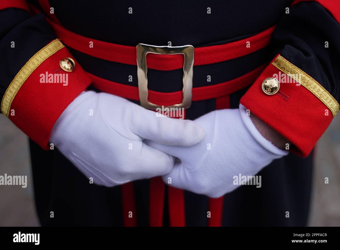 A Yeoman Warder, also known as a Beefeater, displays the King's cypher ...