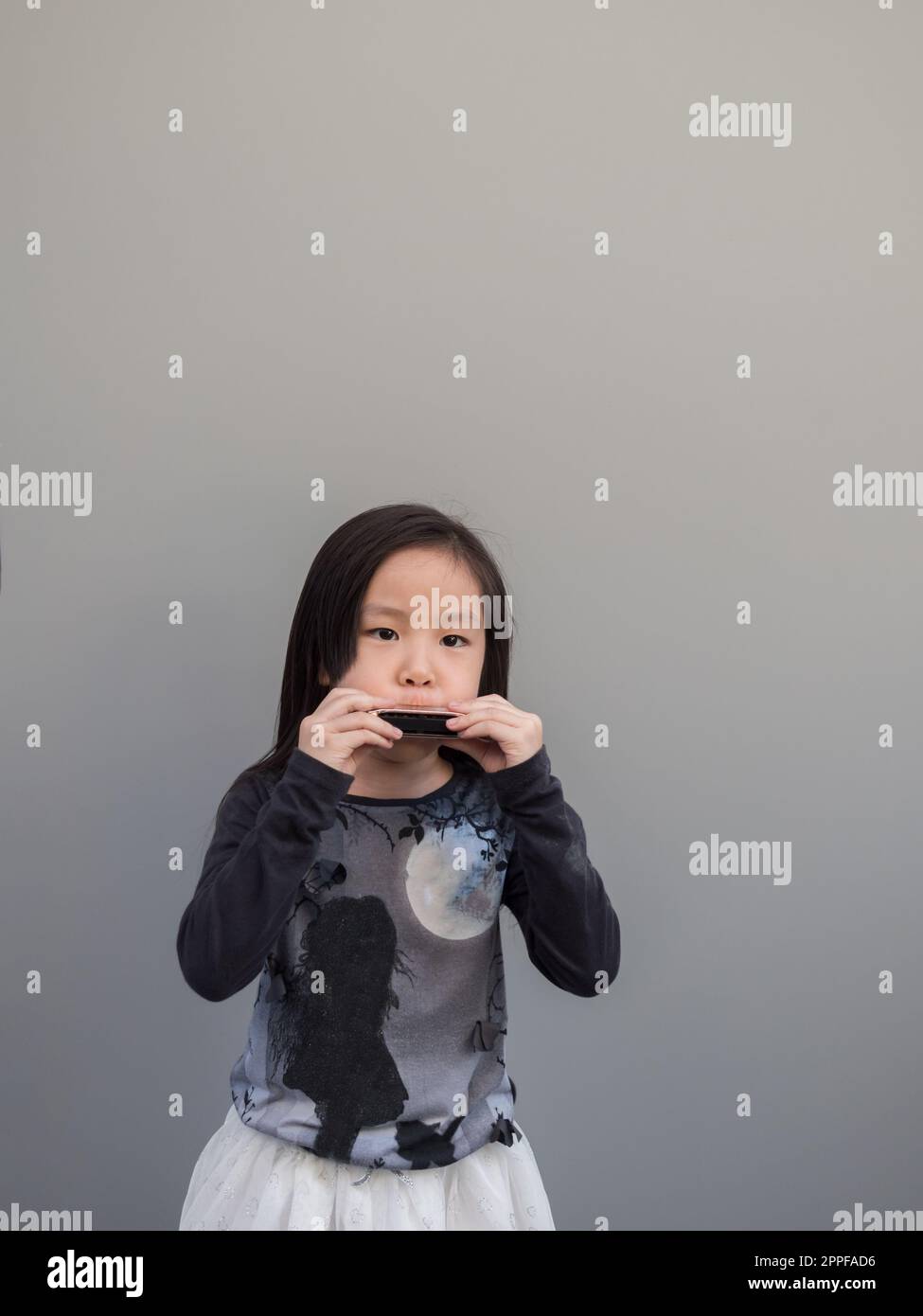 Girl with harmonica hi-res stock photography and images - Alamy