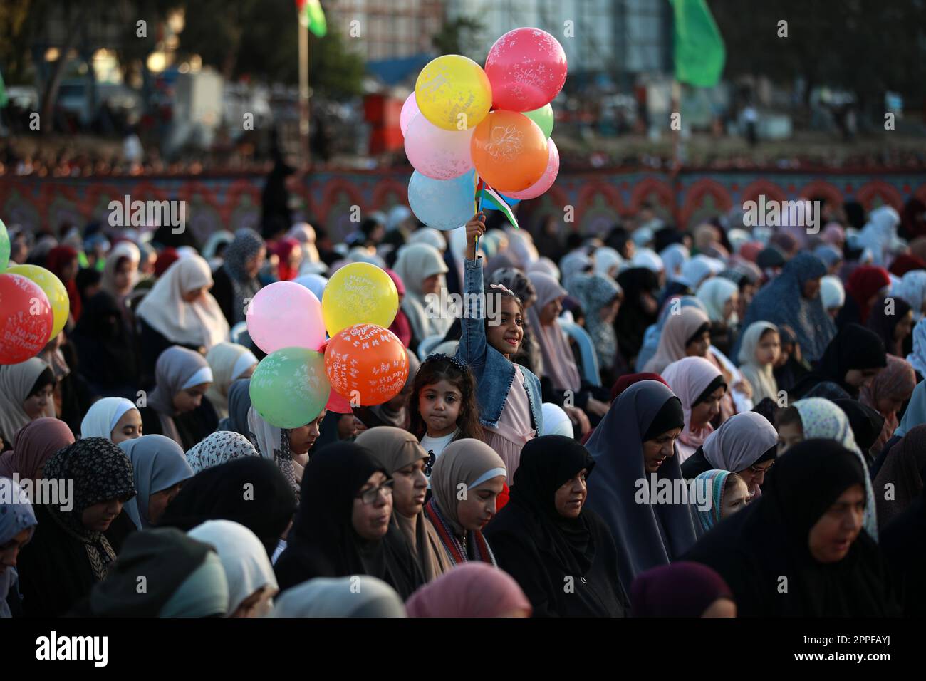 Palestinians perform Eid al-Fitr prayers. Eid al-Fitr, which marks the ...