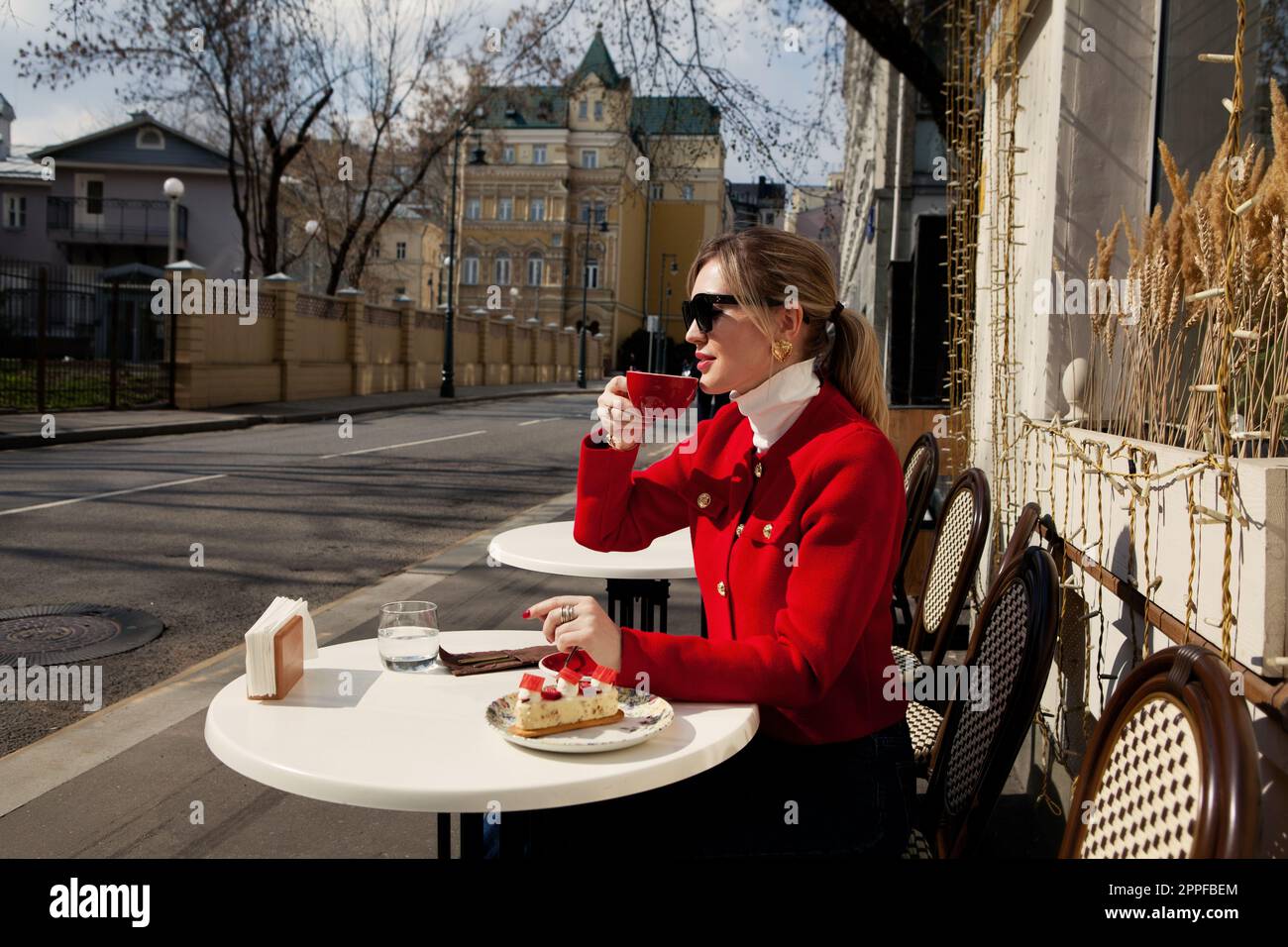 Girl drinks coffee in street hi-res stock photography and images - Alamy