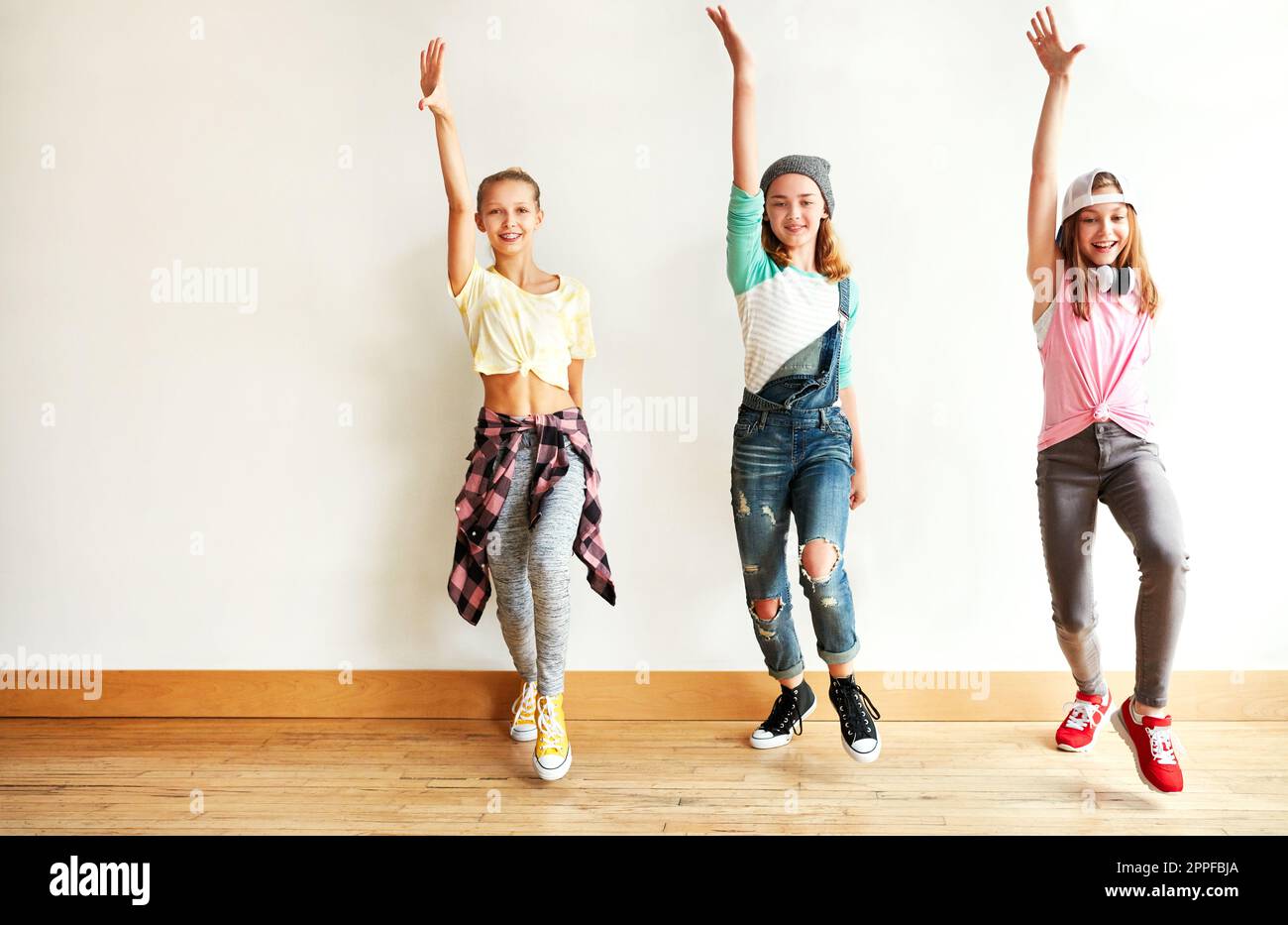 Dancing lifts the spirit. young girls dancing in a dance studio Stock ...