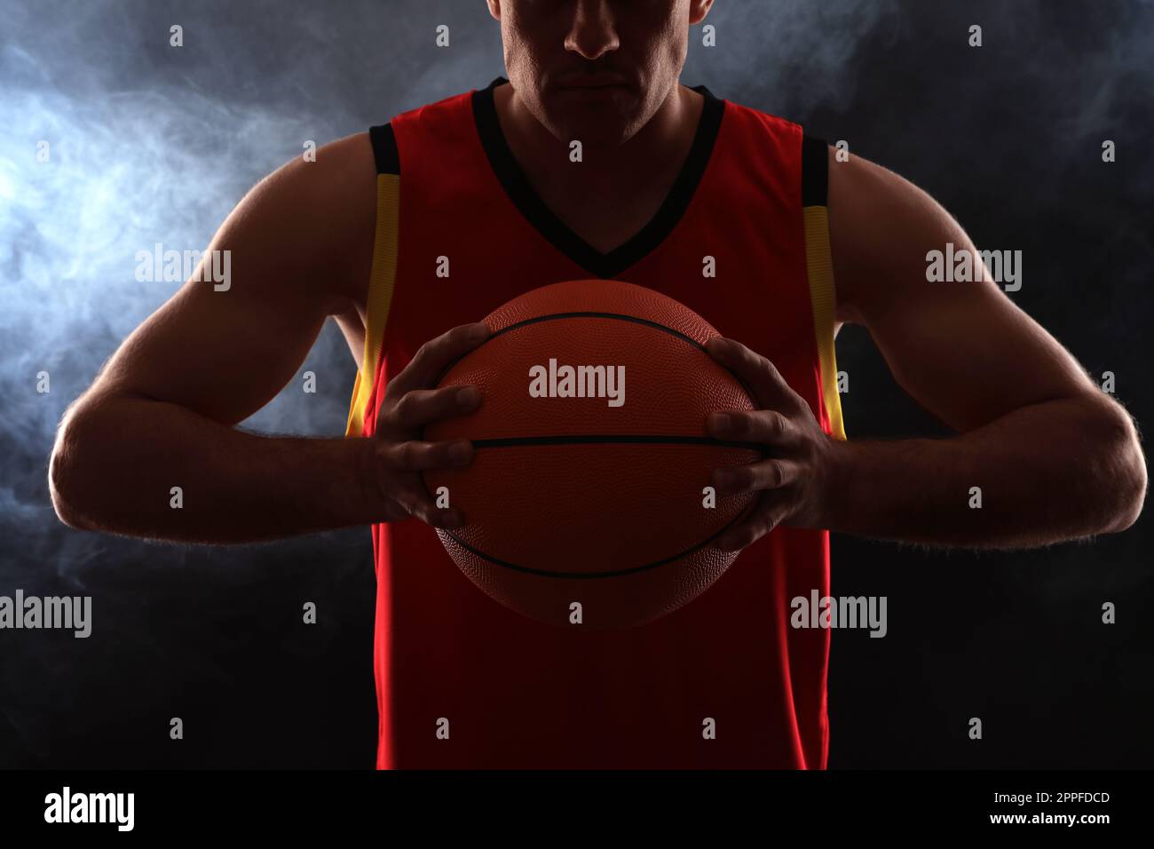 Basketball player with ball on black background, closeup Stock Photo ...