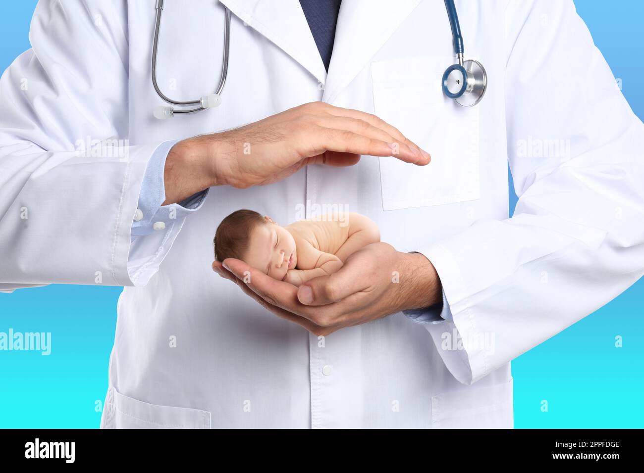 Surrogacy concept. Doctor holding adorable newborn baby on blue ...