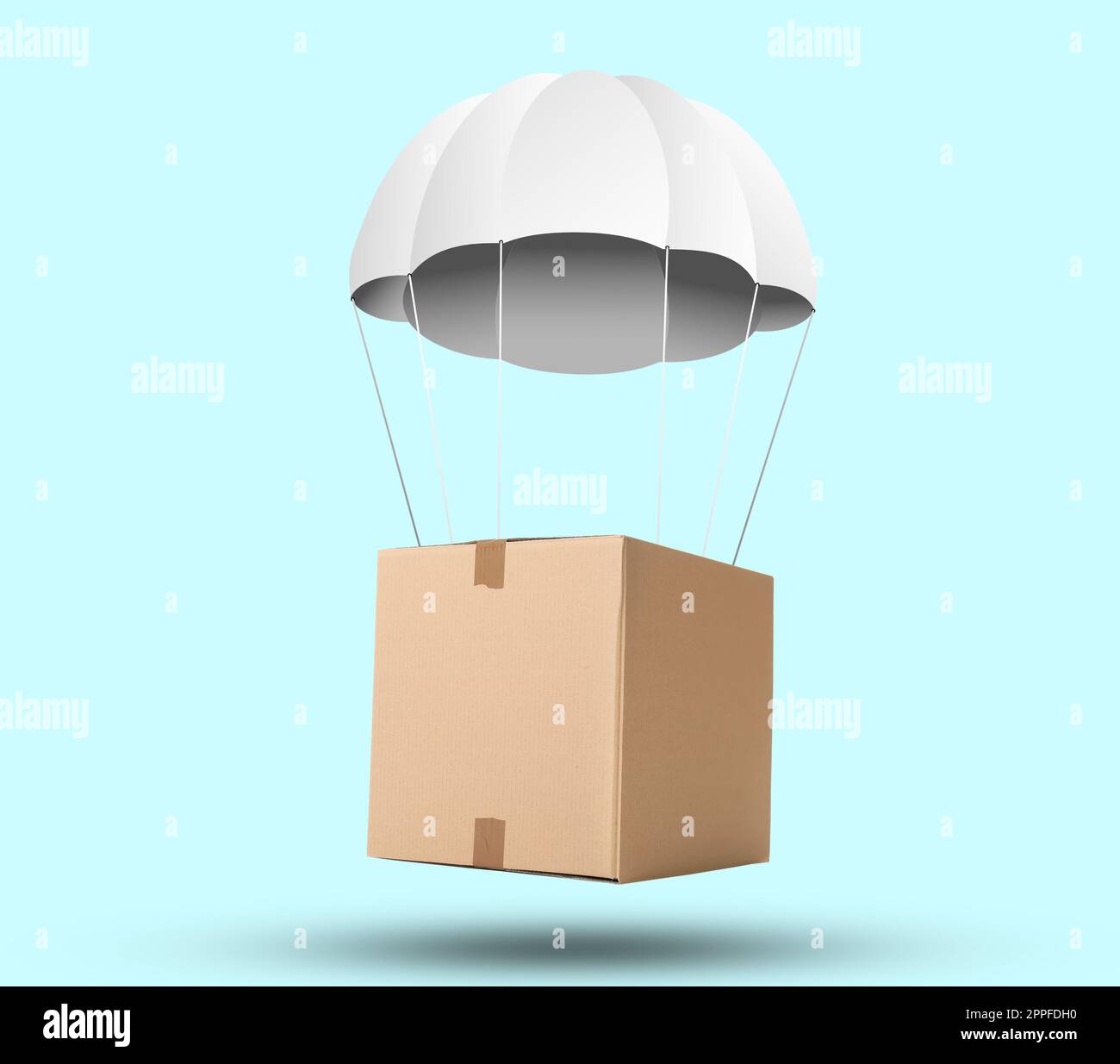 Cardboard box with parachute flying on light blue background Stock ...