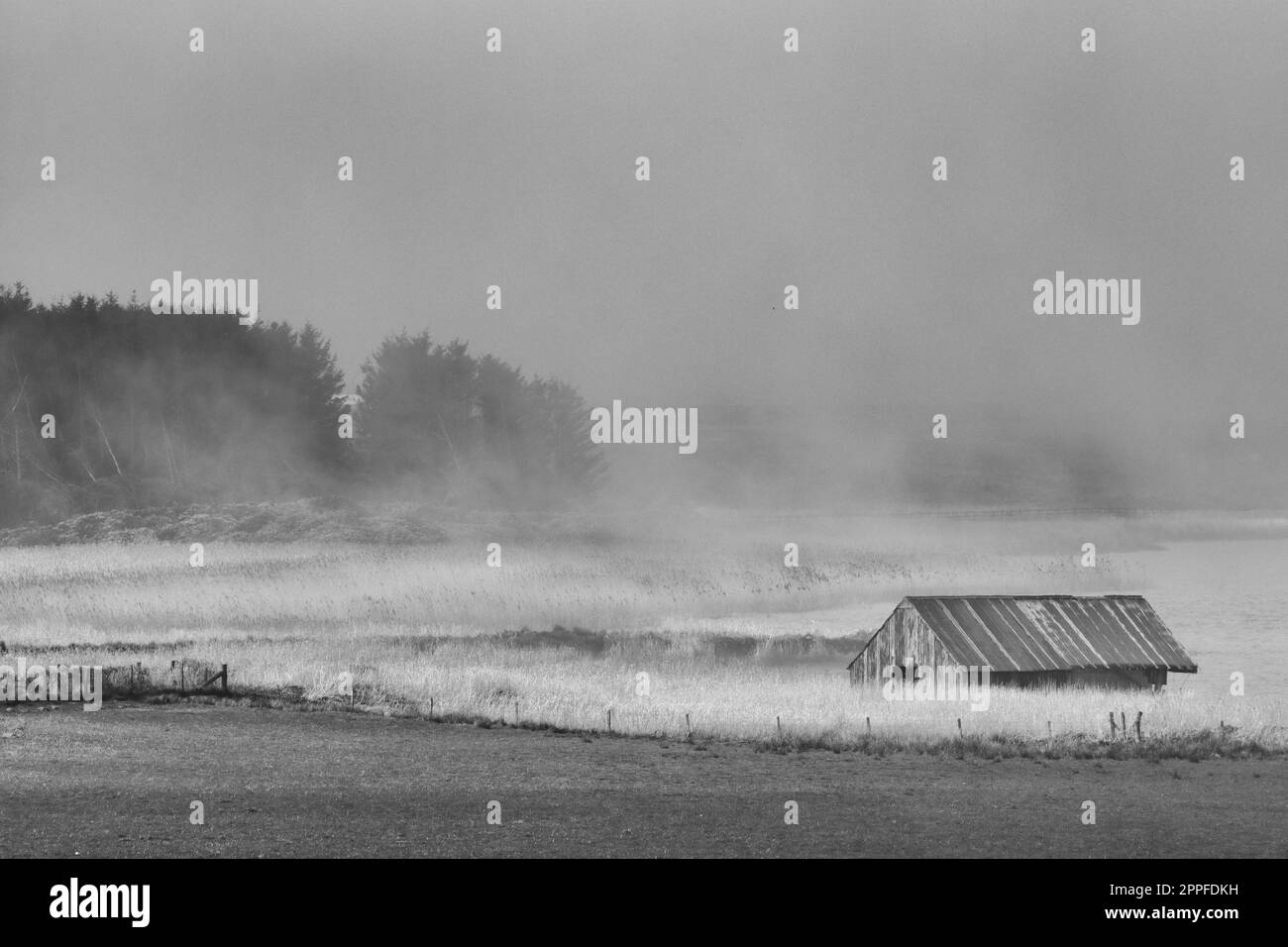 Hut in mist Stock Photo - Alamy