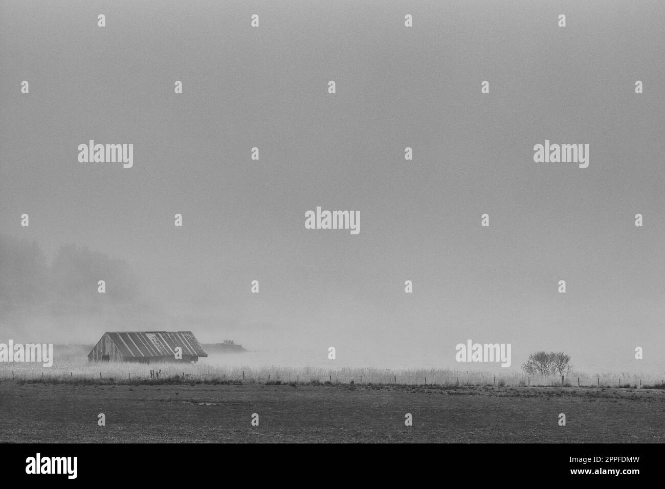 Hut in mist Stock Photo - Alamy