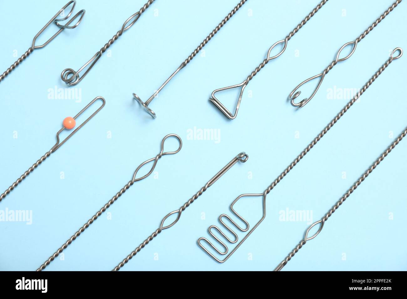 Set of logopedic probes for speech therapy on light blue background ...