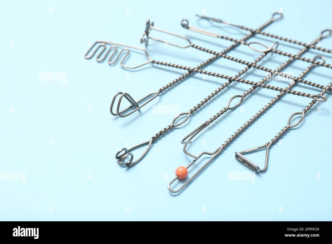 Set of logopedic probes for speech therapy on light blue background ...