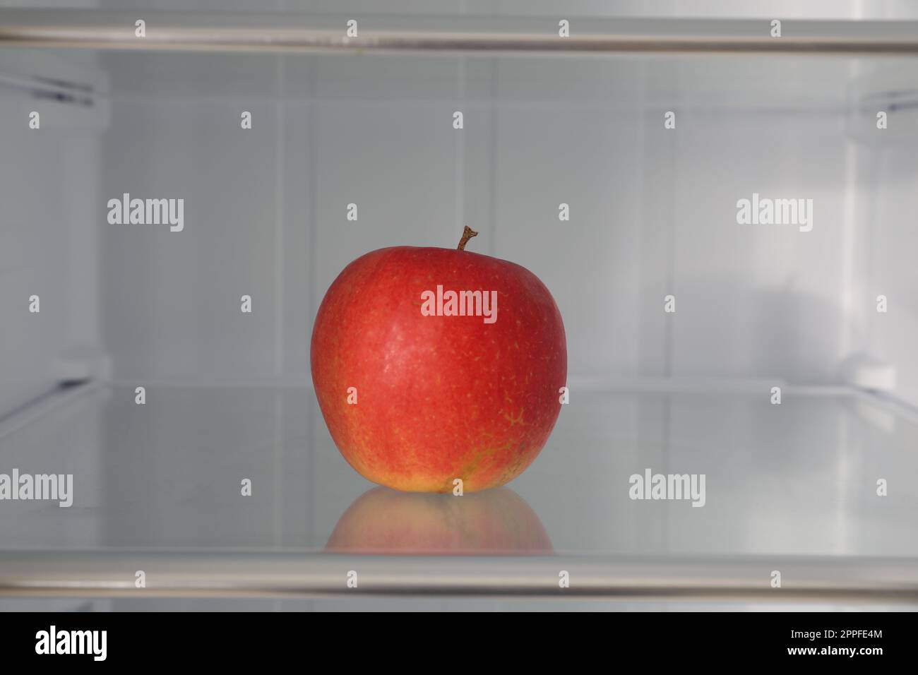 Red apple on shelf inside modern refrigerator Stock Photo - Alamy